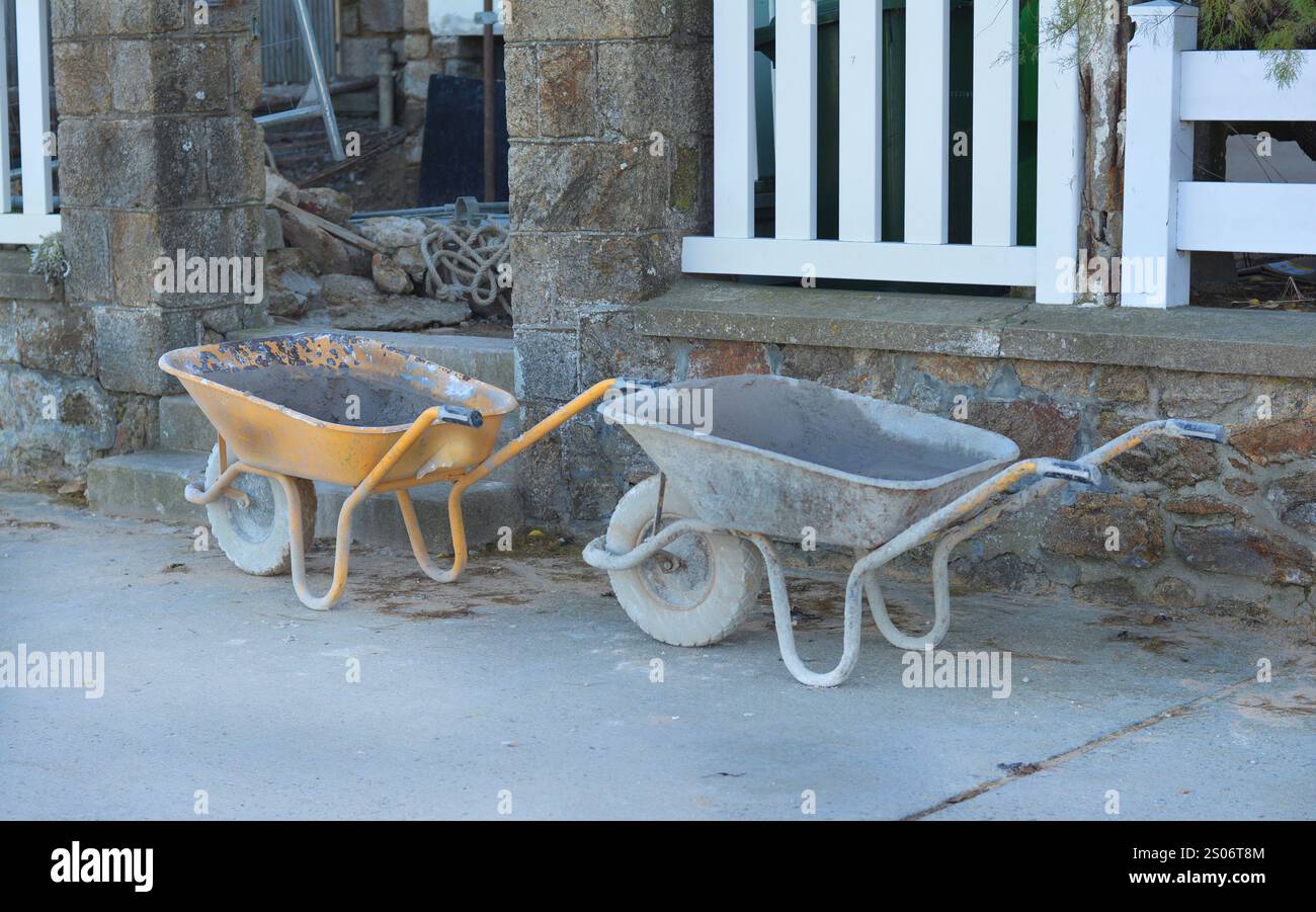 Construction wheelbarrows standing at a building site Stock Photo - Alamy
