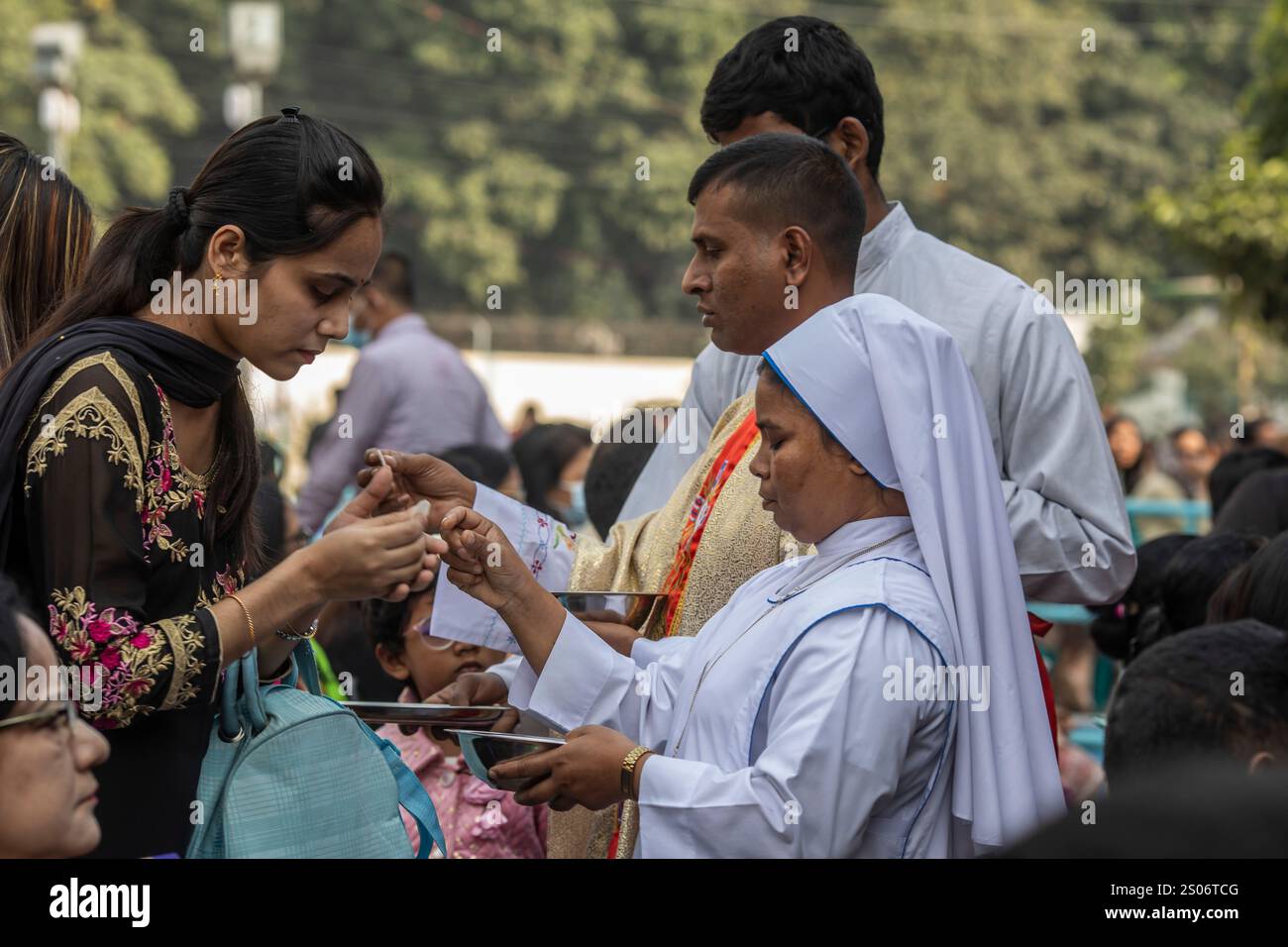 Christian devotees eat holy bread, also known as sacramental bread, and ...