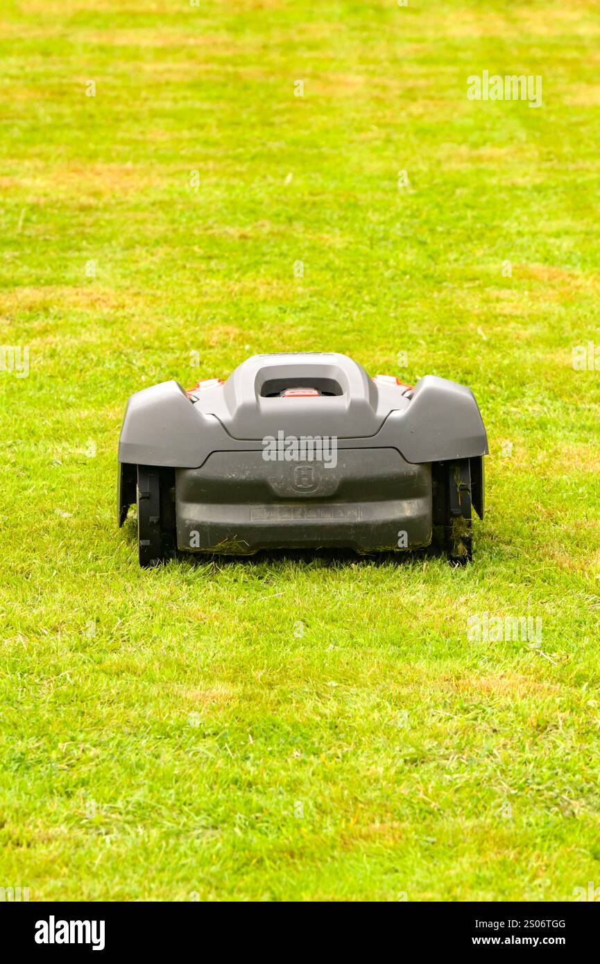 Cowbridge, Vale of Glamorgan, Wales - 7 August 2024: Automatic mowing ...