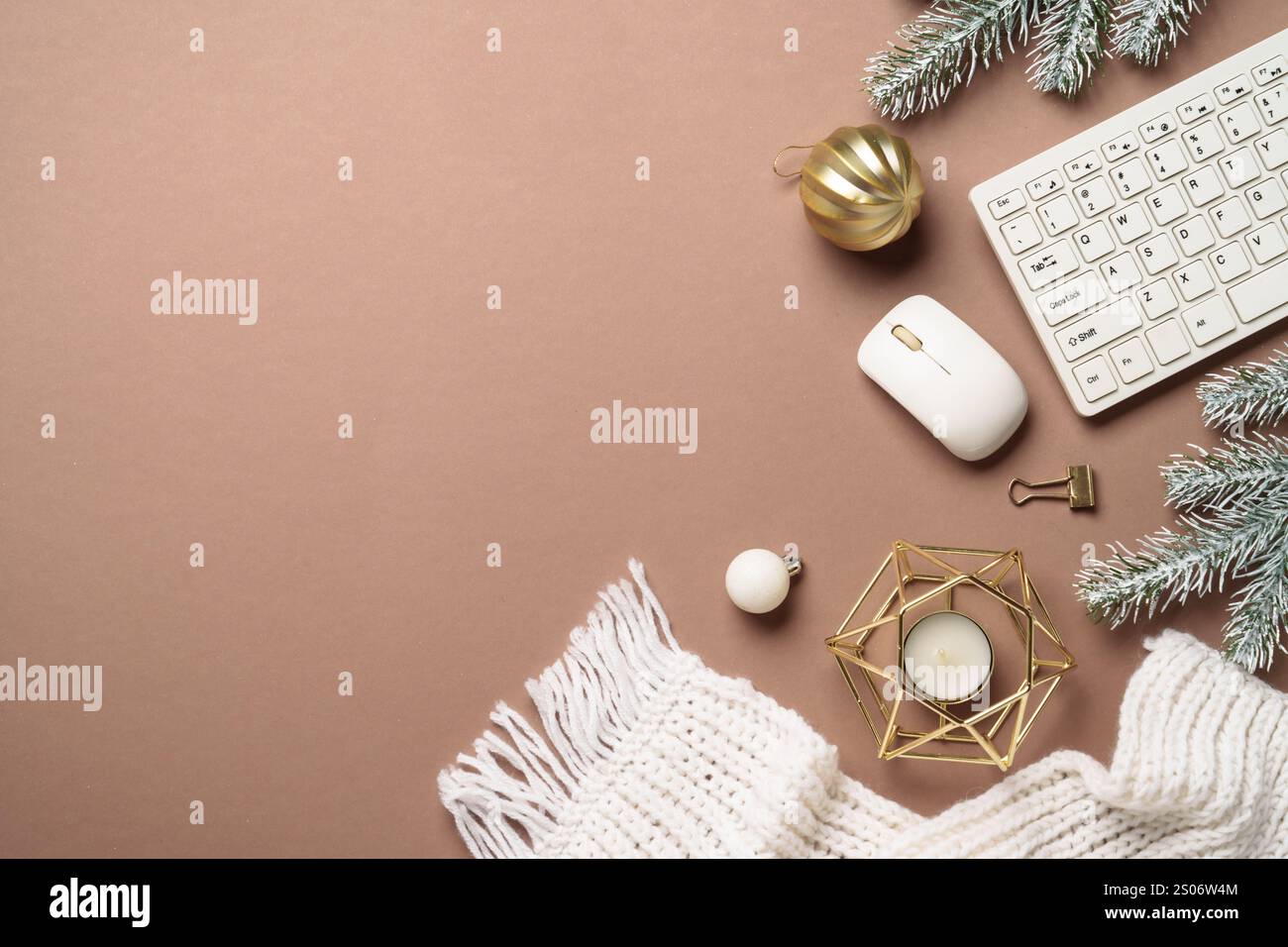 Cozy Winter office desk. Keyboard, candle and winter decor at brown ...