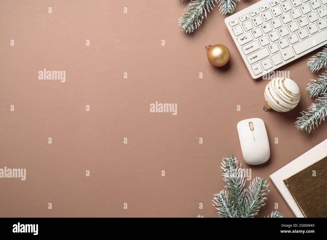 Cozy Winter office desk. Keyboard, candle and winter decor at brown ...