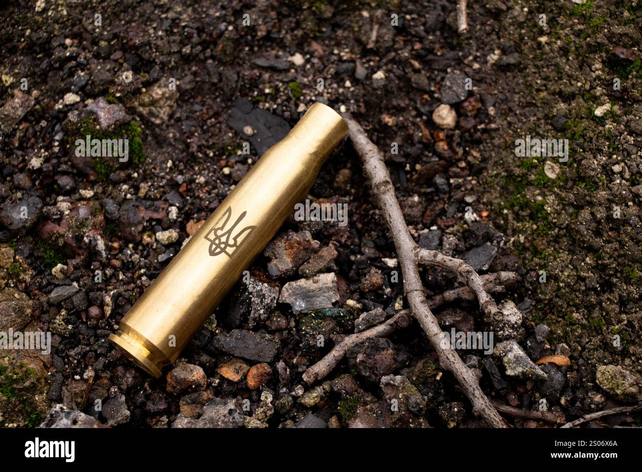 An empty cartridge case with the coat of arms of Ukraine lies on the ...