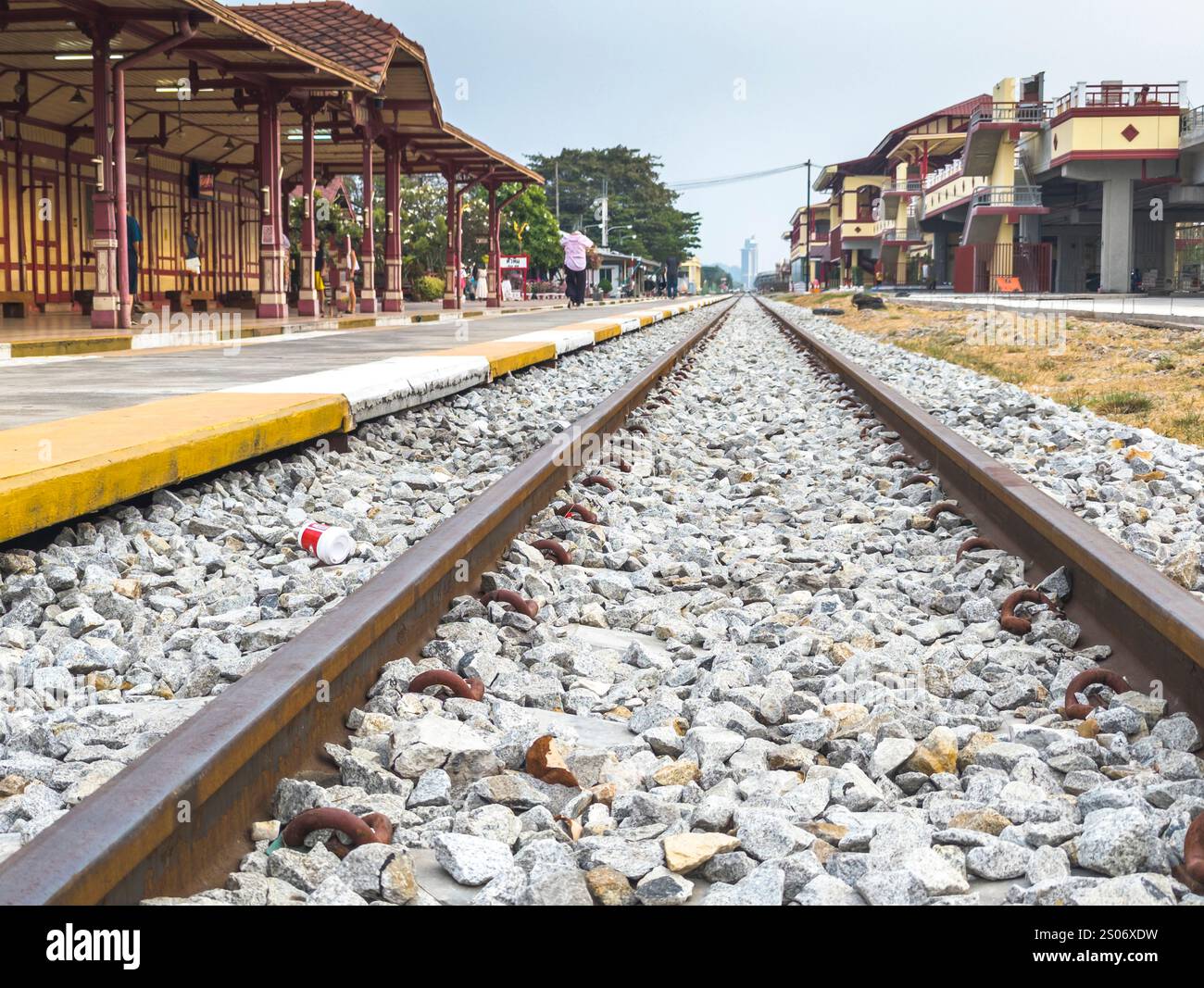 Railroad tracks running between the old Thai Railway station platform ...