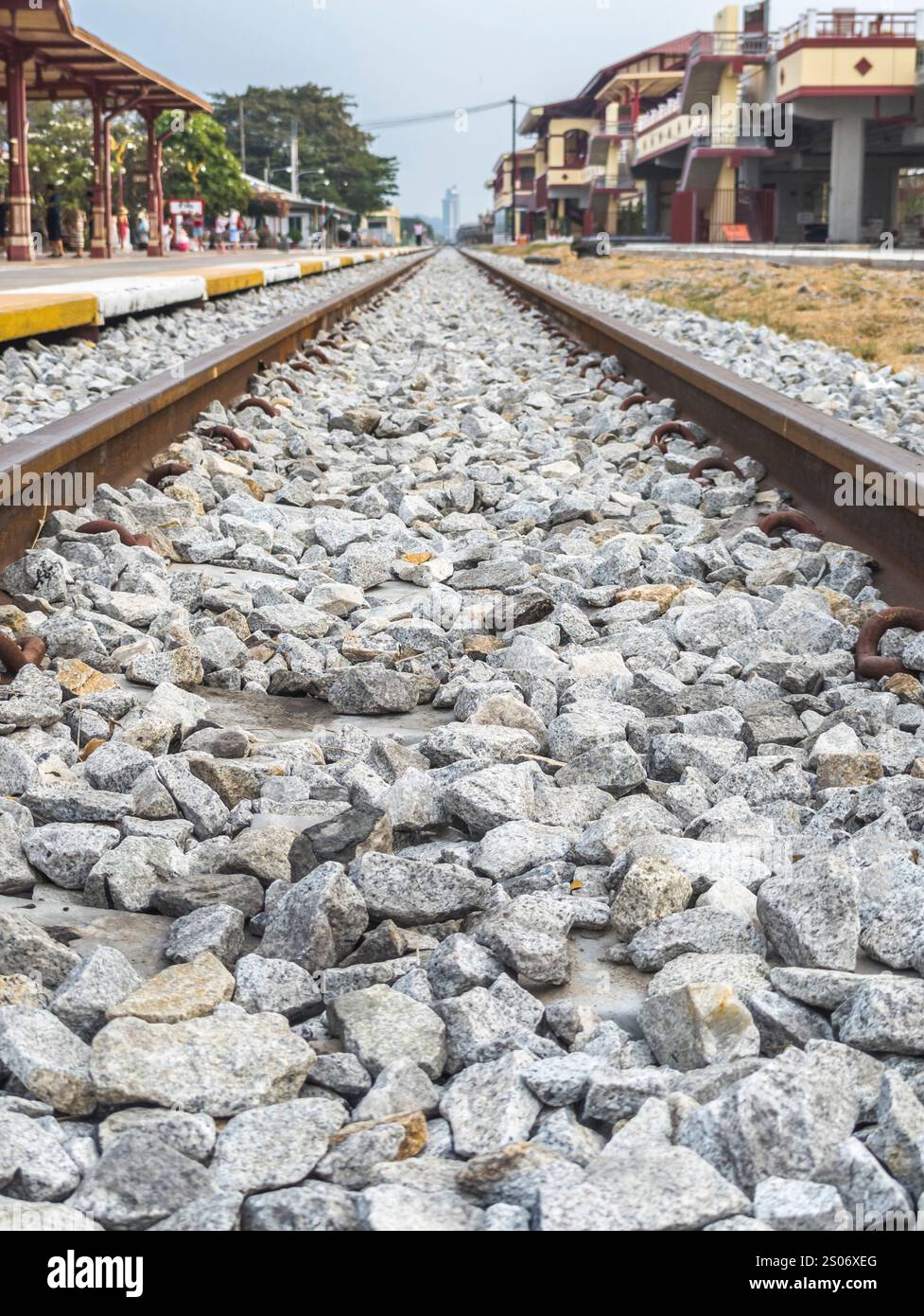 Railroad tracks running between the original older Thai Railway station ...