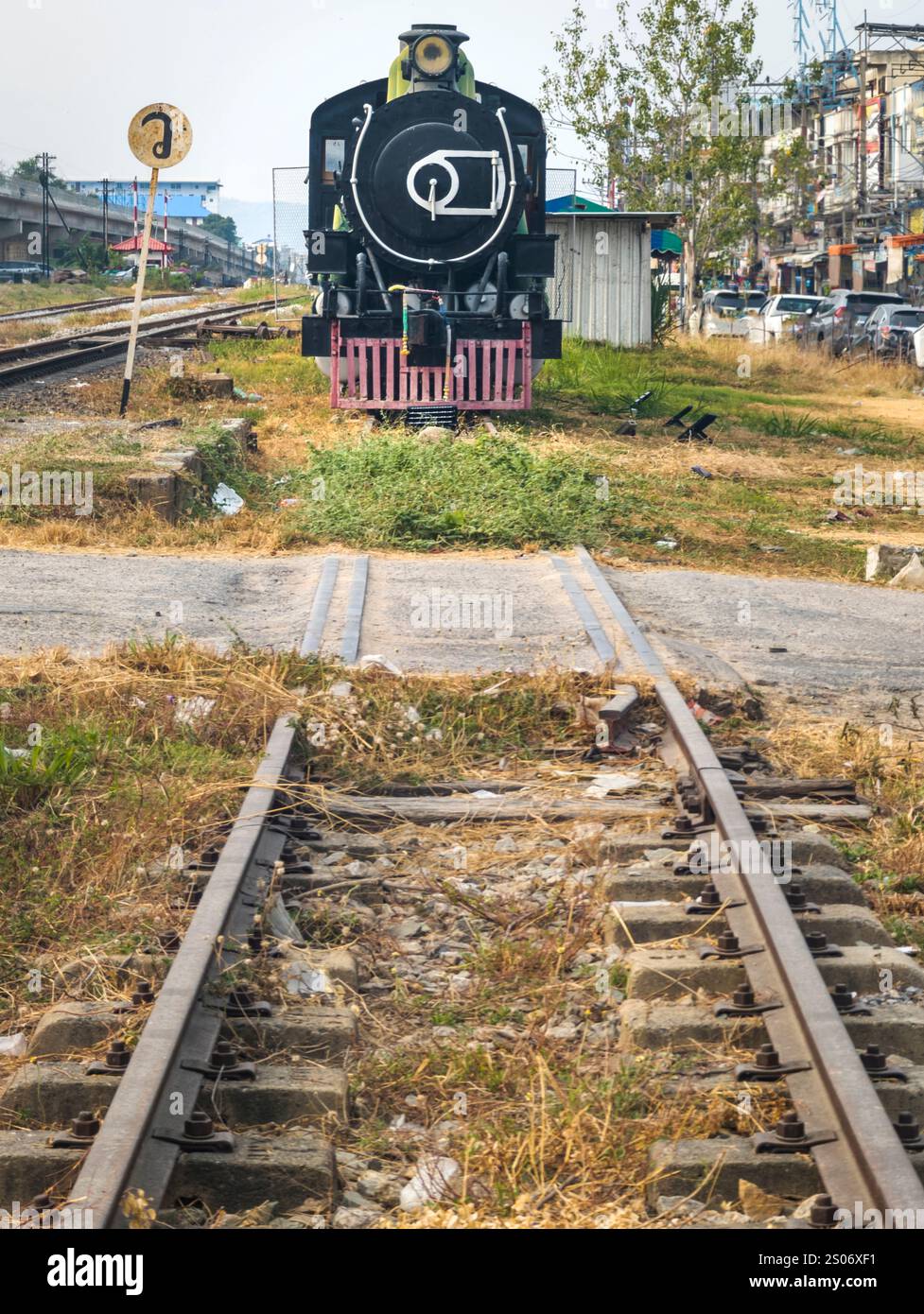 A beautiful disused vintage steam train, standing near to the road ...
