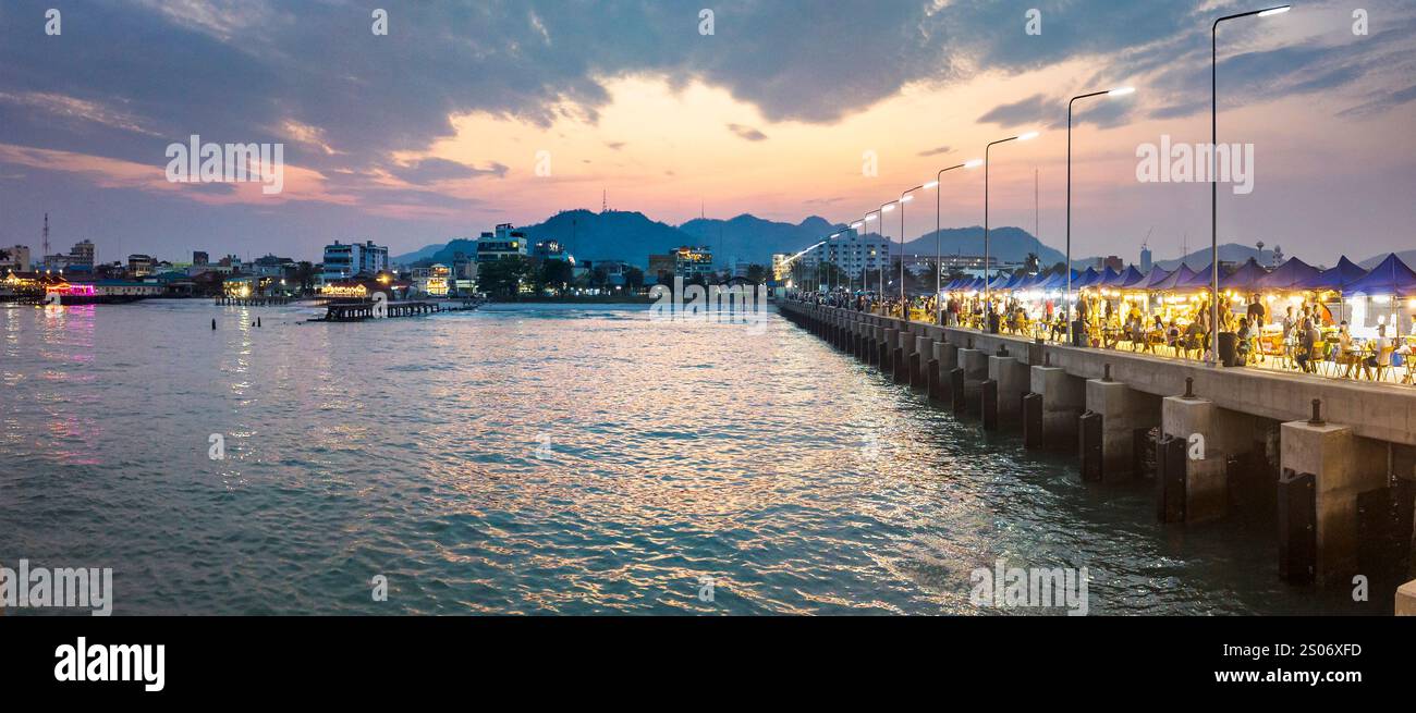Panoramic scene of night food market,and Hua Hin coastline and jetties ...
