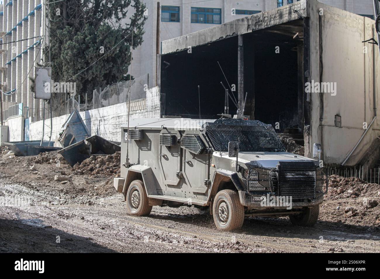 Tulkarm, Palestine. 25th Dec, 2024. Israeli military vehicles drive ...