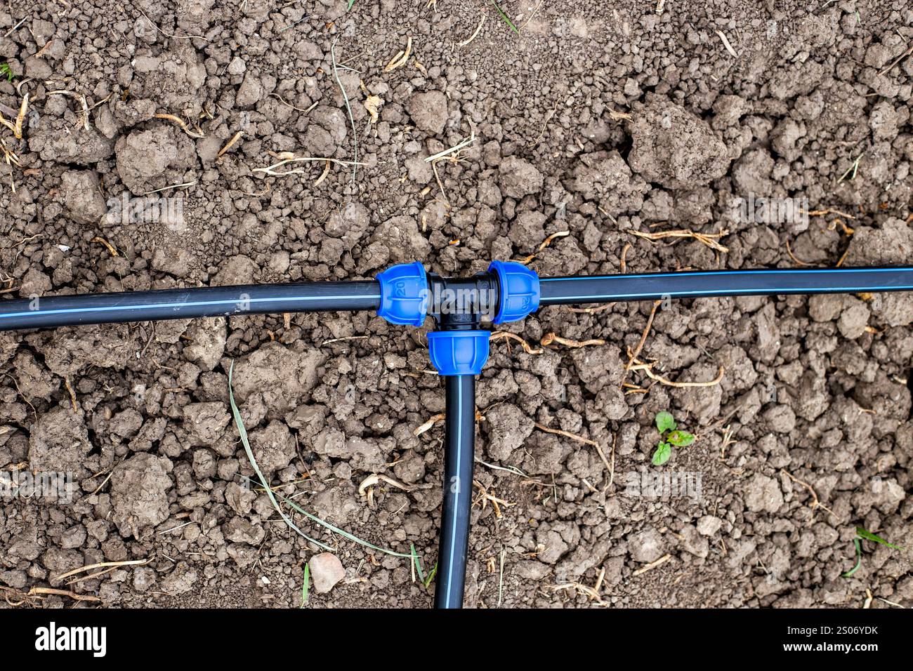 Drip irrigation pipes for gardens with branching on the ground ...