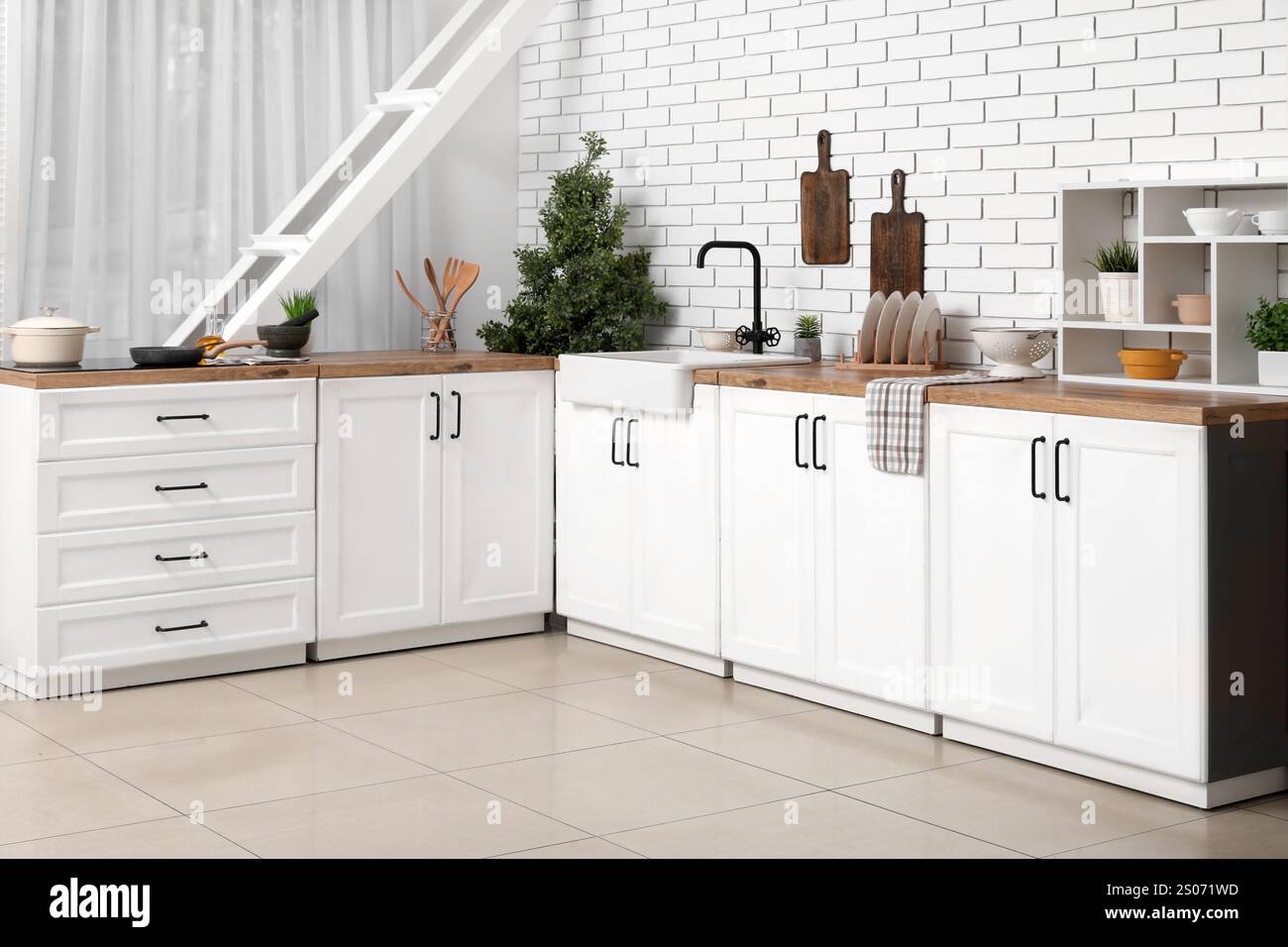 Interior of kitchen with counters, shelving unit and utensils Stock ...