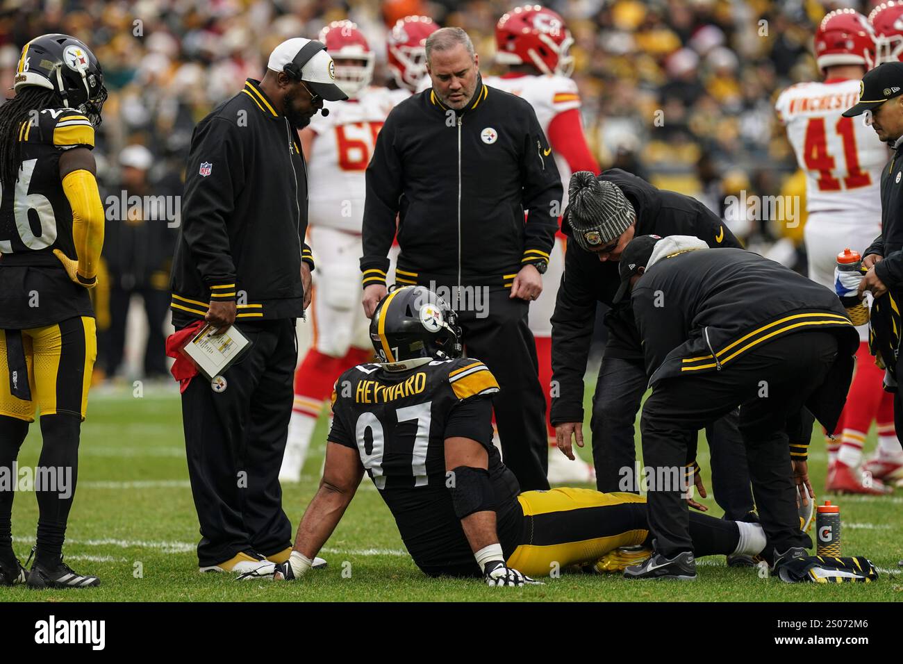 Pittsburgh Steelers defensive tackle Cameron Heyward (97) is helped ...