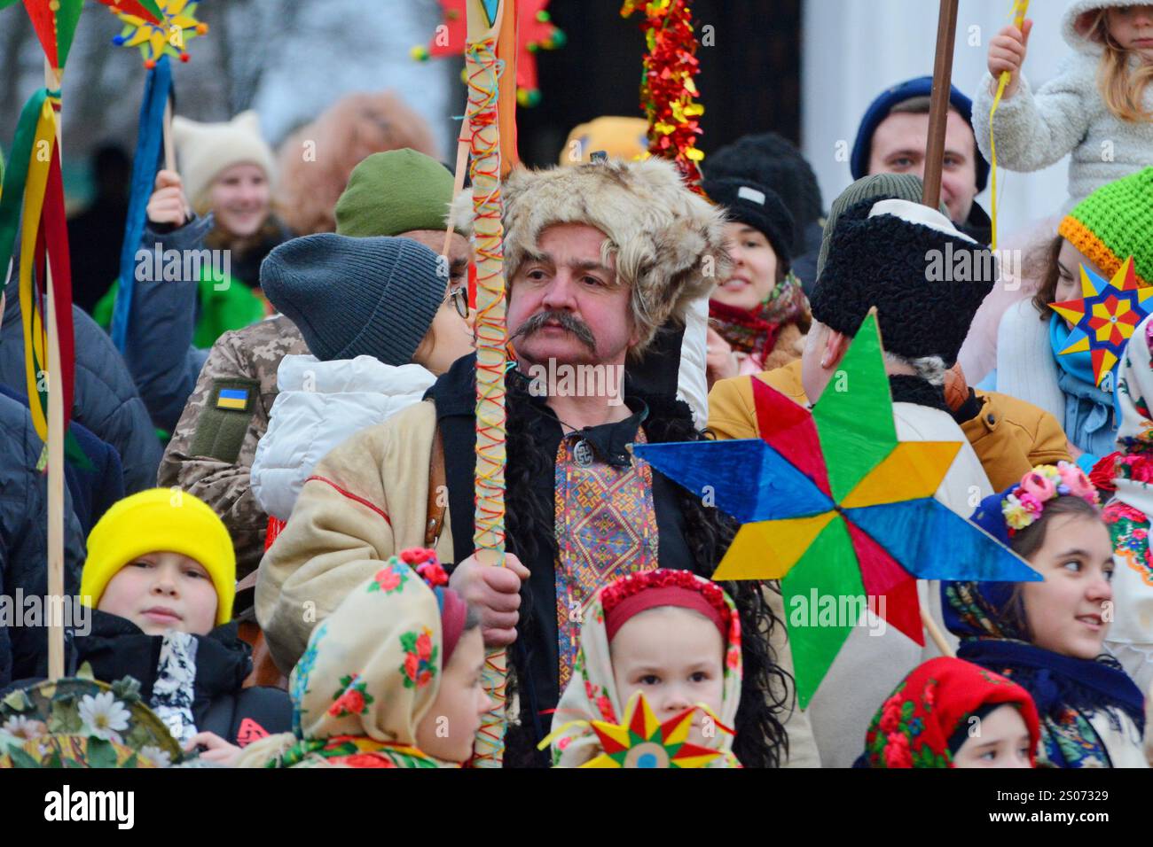 Kyiv, Ukraine. 25th Dec, 2024. People in traditional costumes hold ...