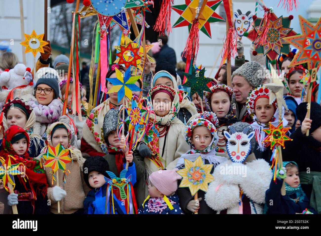 Kyiv, Ukraine. 25th Dec, 2024. Children in traditional costumes hold ...