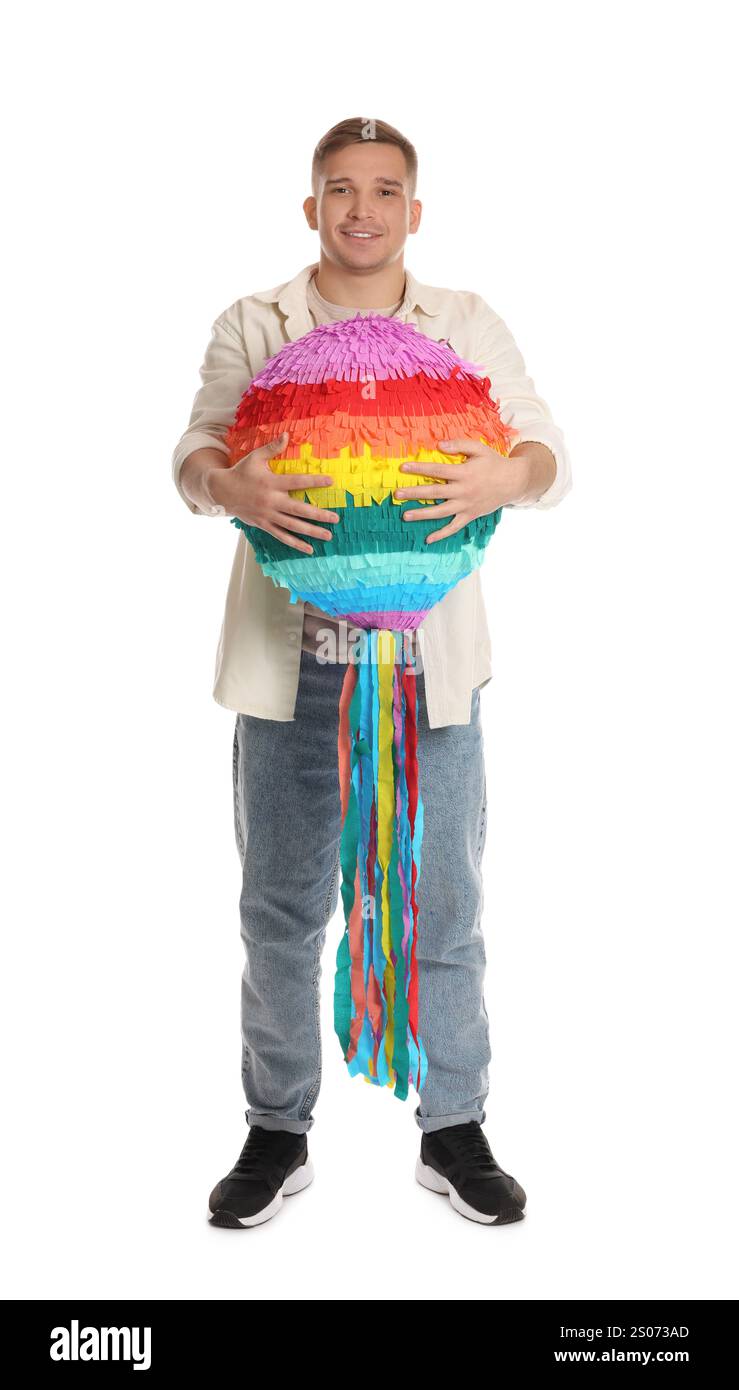 Happy man with colorful pinata on white background Stock Photo - Alamy