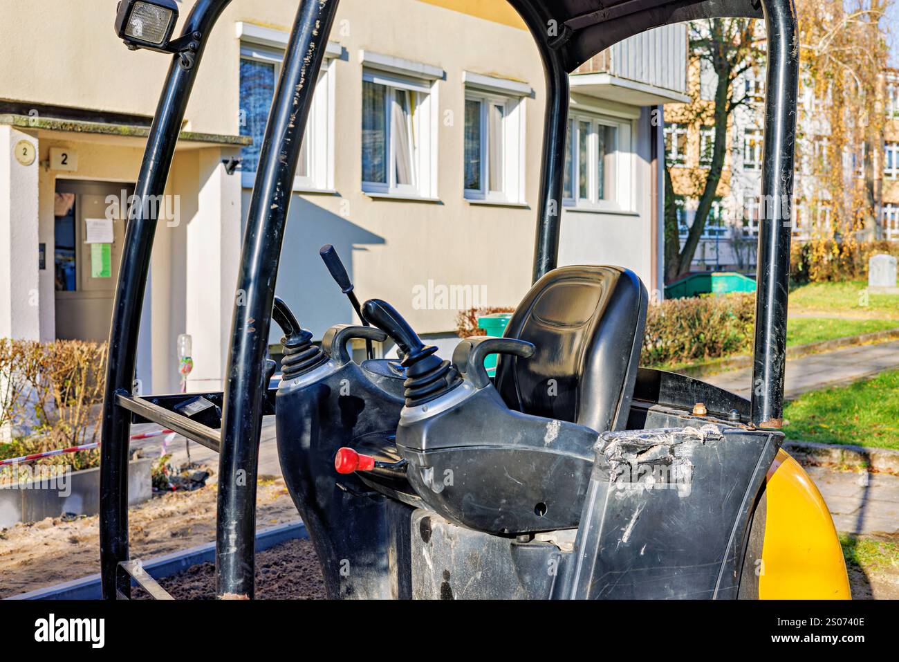 Open cabin of a small excavator with control levers in it Stock Photo ...