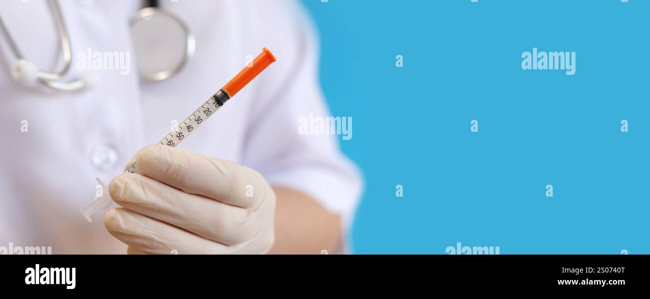 Insulin syringe. Nurse or doctor with syringe. Female hand in gloves ...