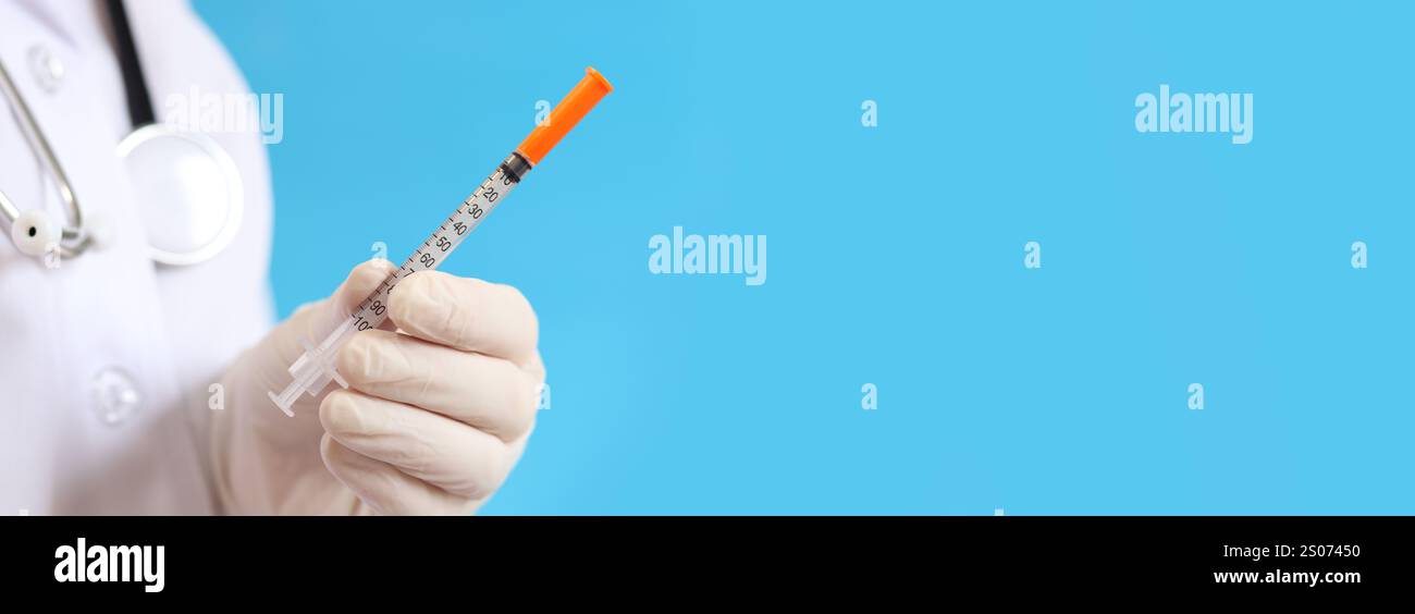 Insulin syringe. Nurse or doctor with syringe. Female hand in gloves ...