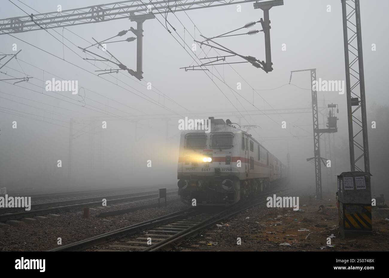 New Delhi, India. 25th Dec, 2024. GURUGRAM, INDIA - DECEMBER 25: A passenger train moving from ...