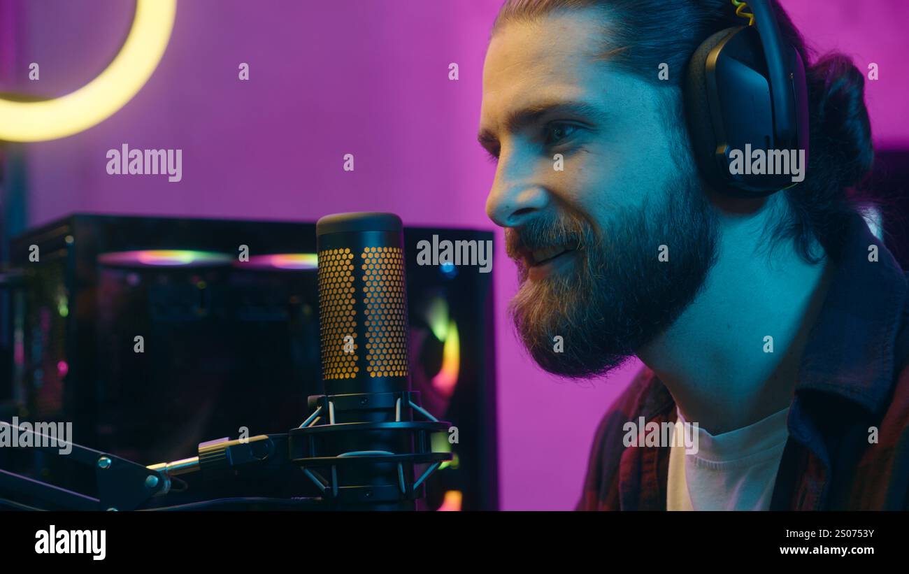 Carefree Caucasian vlogger gamer man guy host smile streamer playing ...