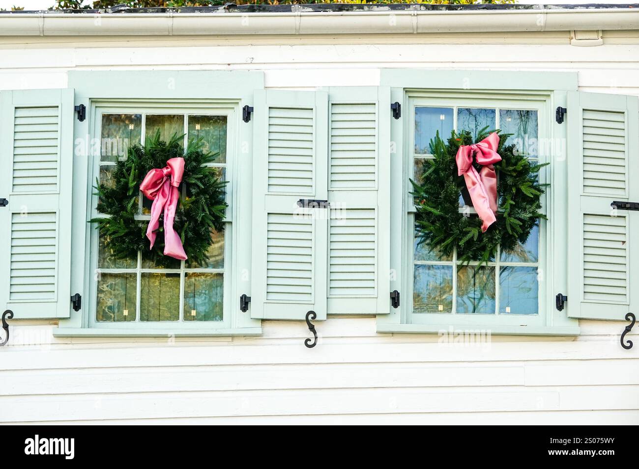 Christmas wreaths decorate the window of the Dothage-Lempesis House ...