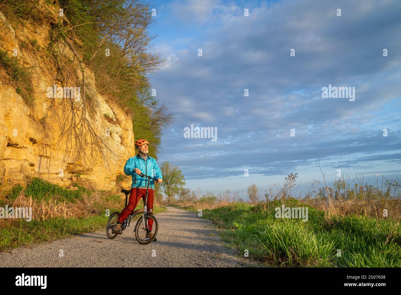 senior male cyclist riding a folding bike on Steamboat Trace, bike ...
