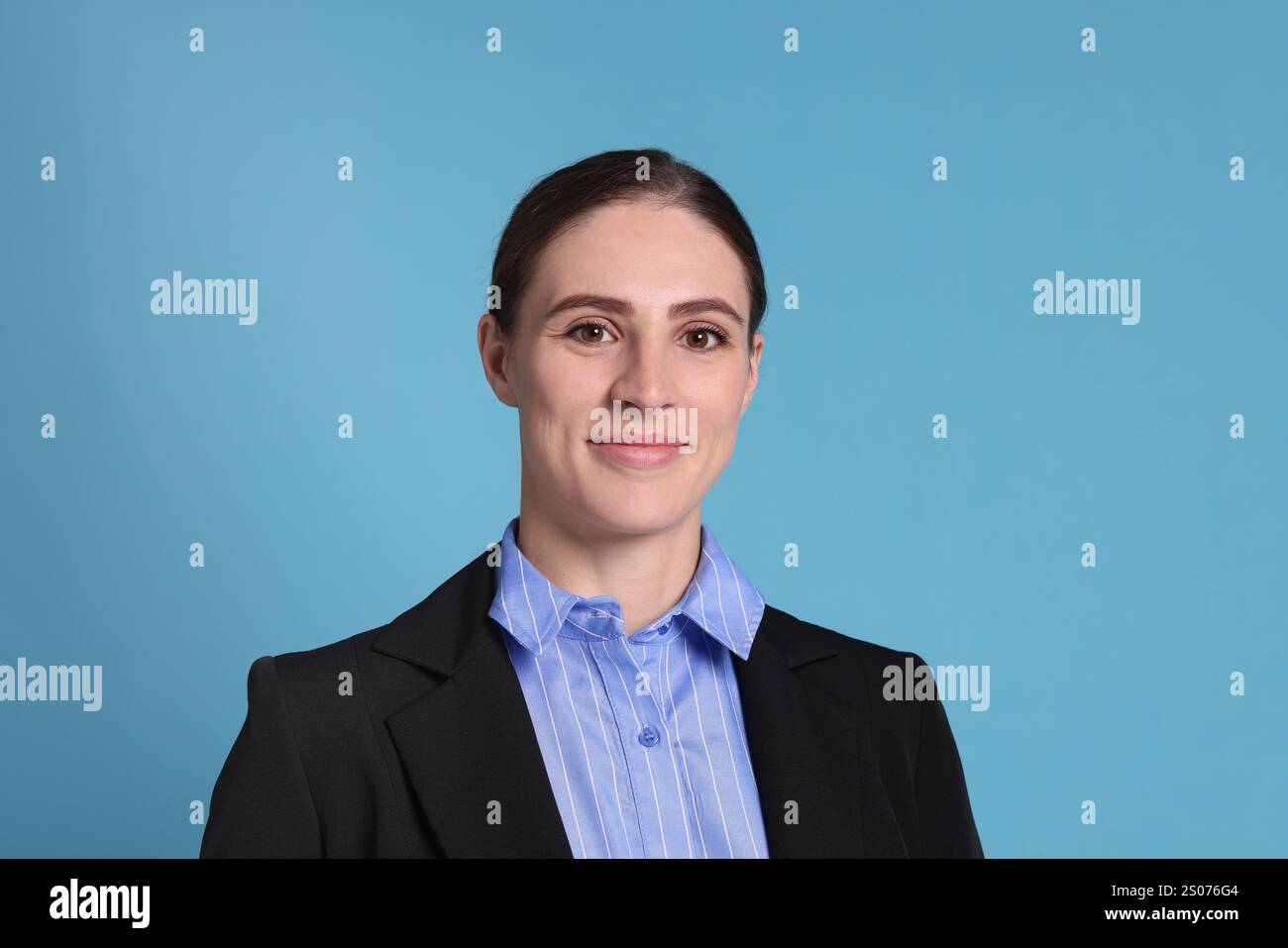 Portrait of banker on light blue background Stock Photo - Alamy