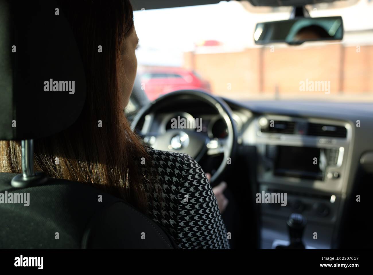 Driver behind steering wheel of modern car, view from inside Stock ...