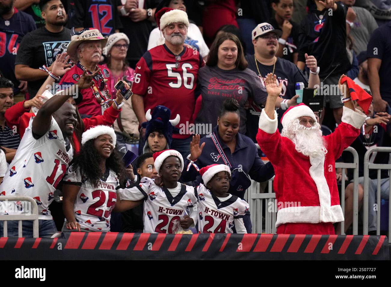Fans cheer during the first half of an NFL football game between the ...