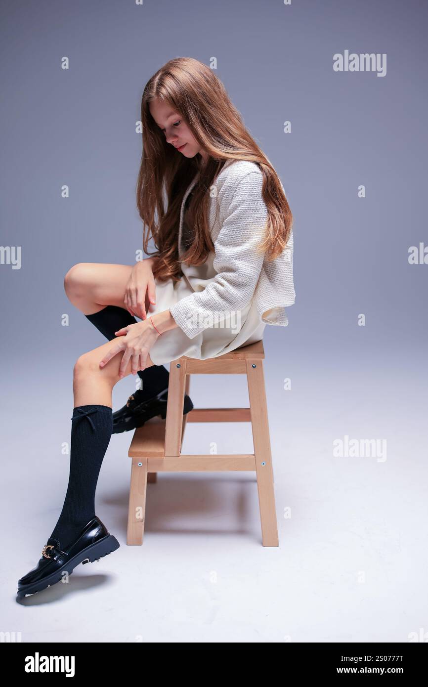 An Impressive and Stylish Portrait Featuring a Model on a Stool Set in ...