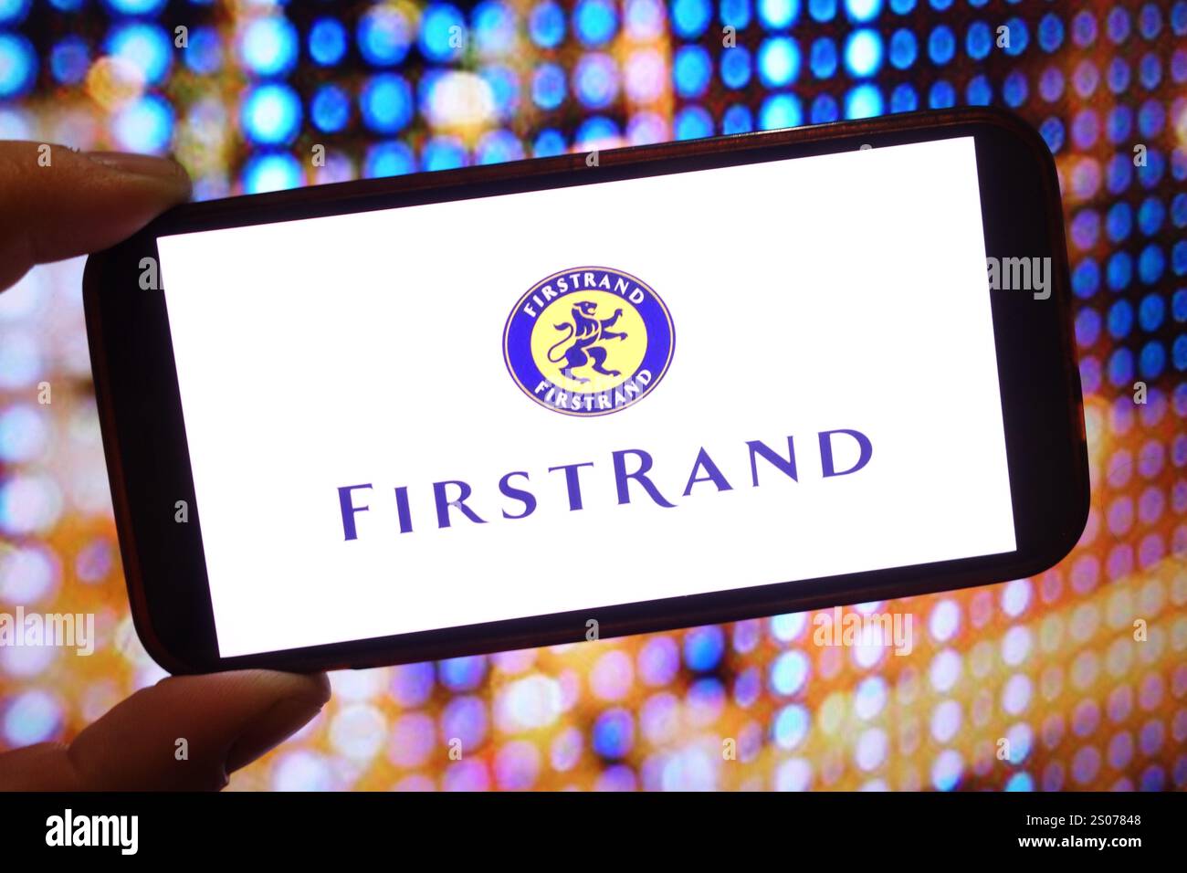 In this photo illustration, the FirstRand Limited company logo is seen ...