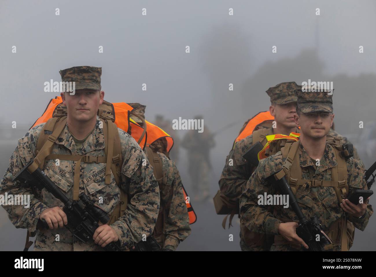 U.S. Marine Corps Sgt. Matthew Veil, left, embarkation chief, and Staff ...