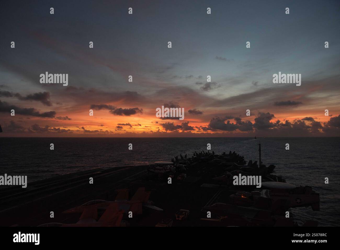 241223-N-GC639-1019 BALABAC STRAIT (Dec. 23, 2024) The Arleigh Burke ...