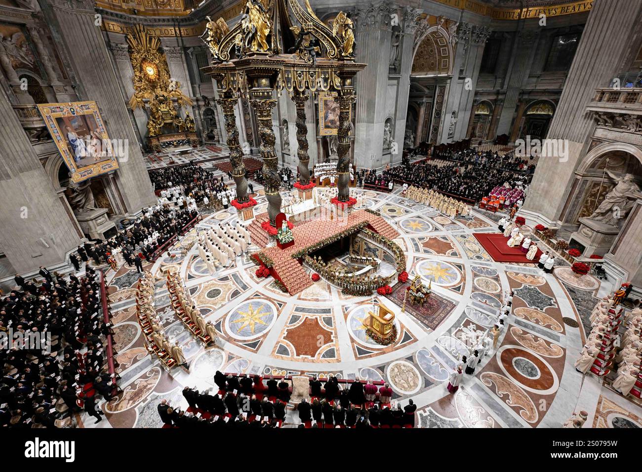 In this photo provided by Vatican Media, Pope Francis presides over the Christmas Eve Mass in St ...