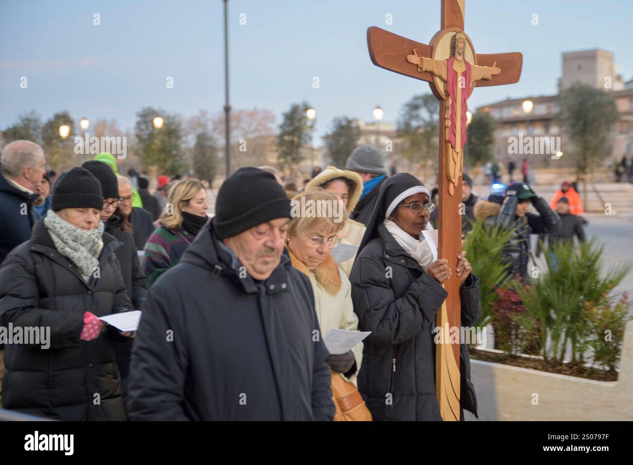 Rome, Italy. 25th Dec, 2024. A nun carries the official Jubilee Cross ...