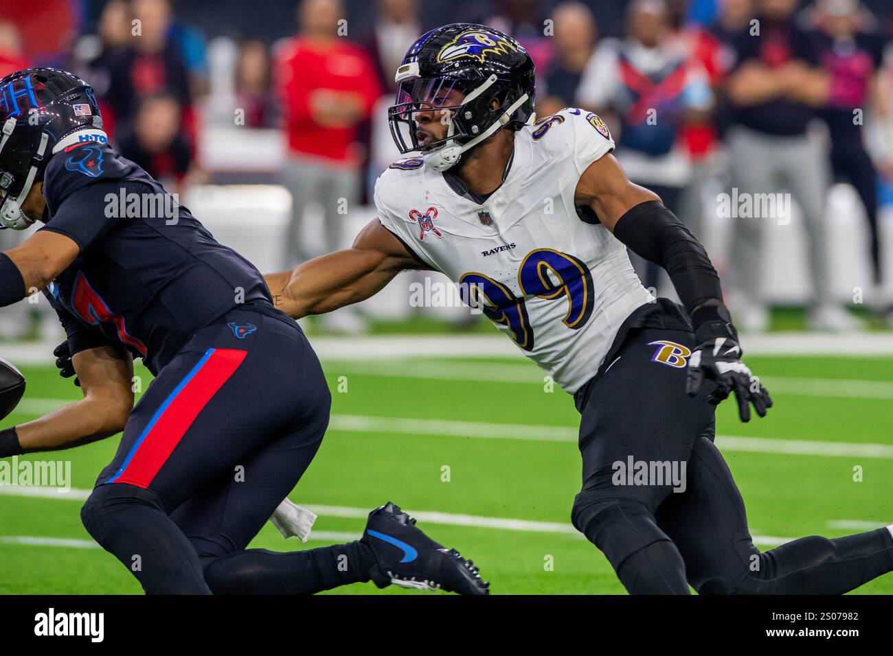 December 25, 2024: Baltimore Ravens linebacker Odafe Oweh (99) sacks Houston Texans quarterback ...
