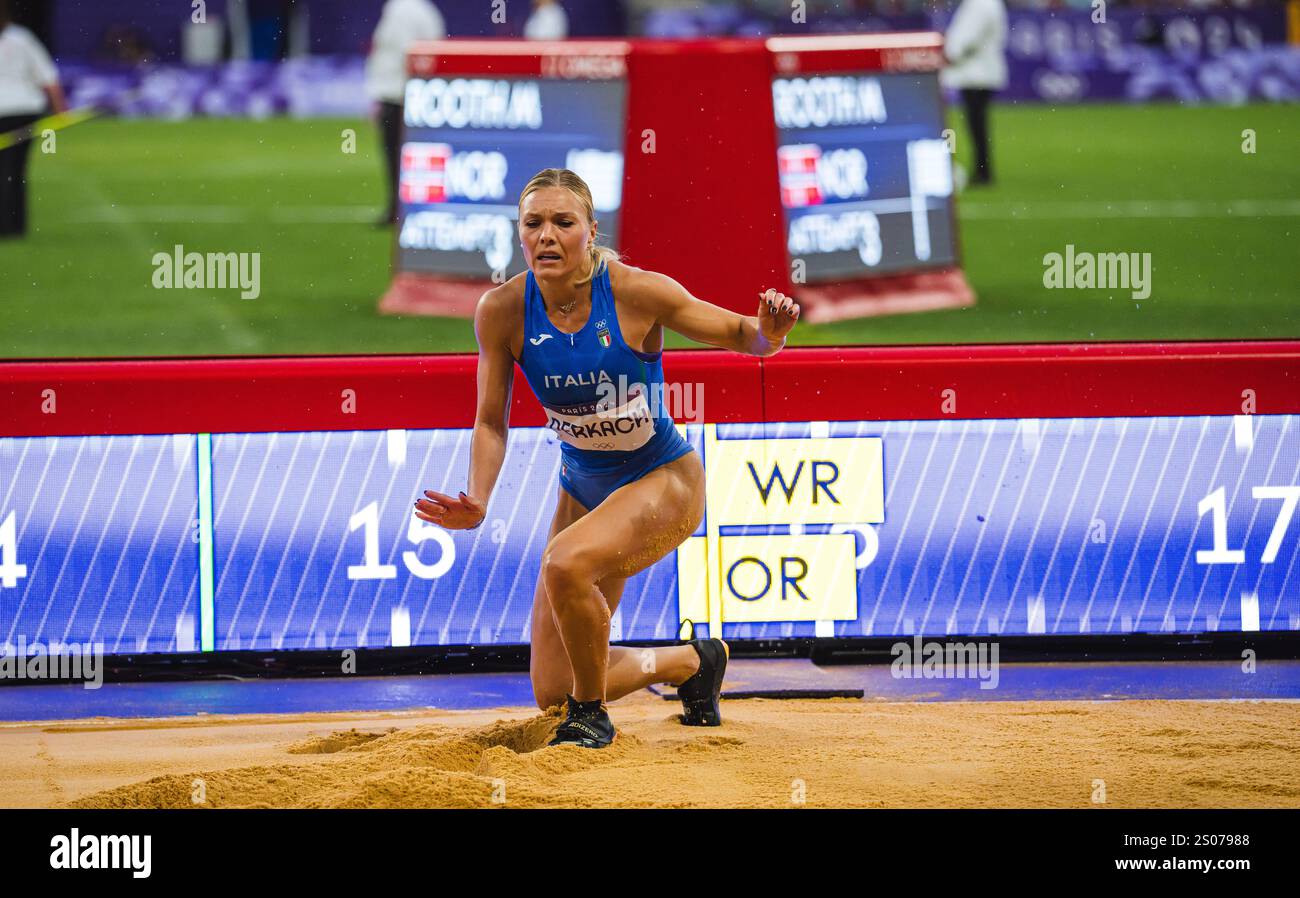 Dariya Derkach participating in the triple jump at the Paris 2024 ...