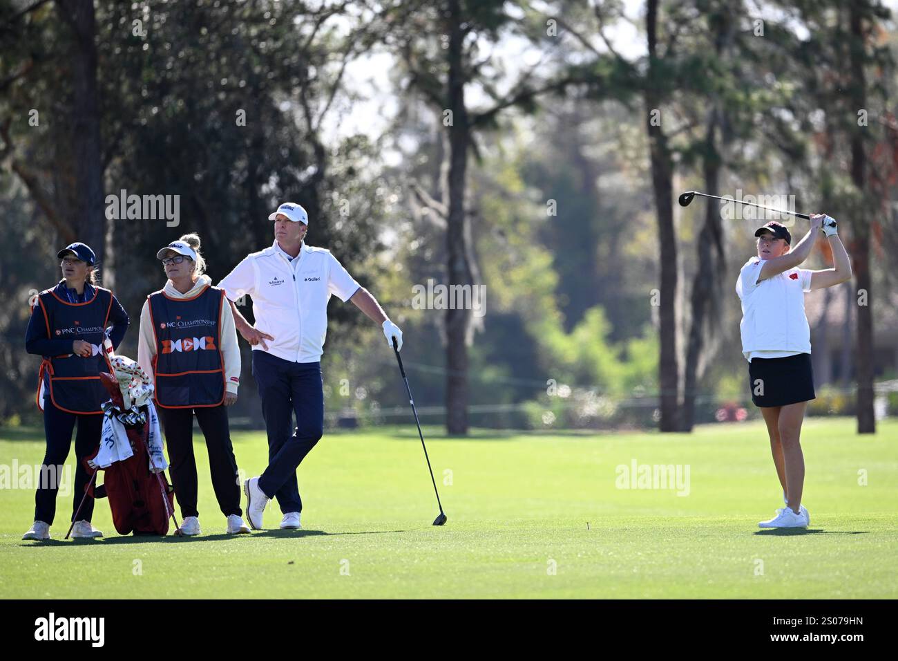 Steve Stricker, second from right, looks on as his daughter Izzi ...