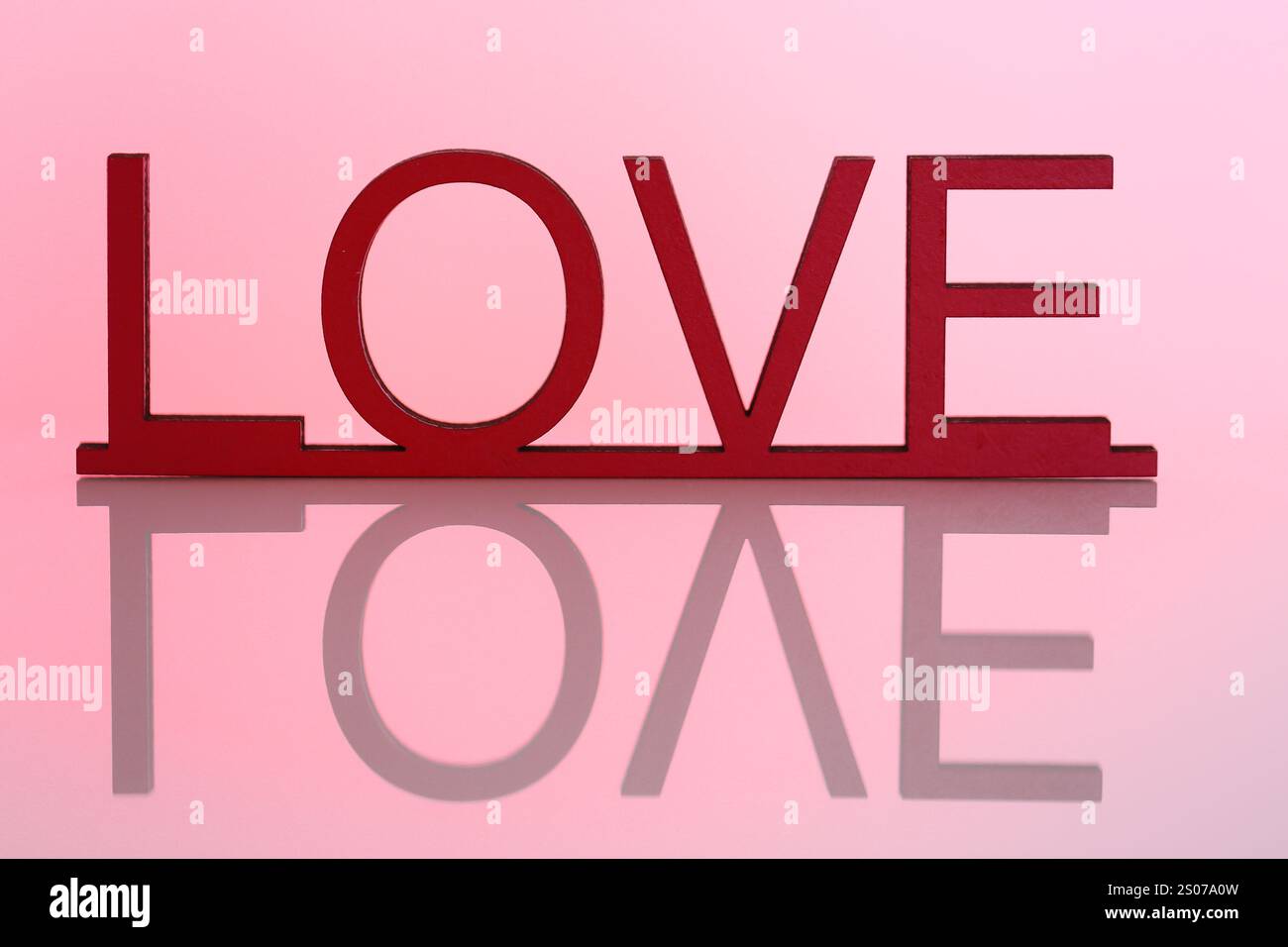 Love Typography with Reflection. word love on a pink background with ...