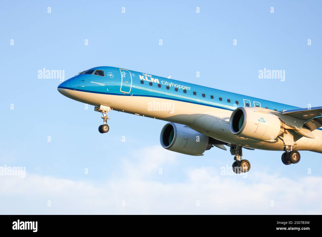Modern passenger airplane approaching runway during final descent at ...