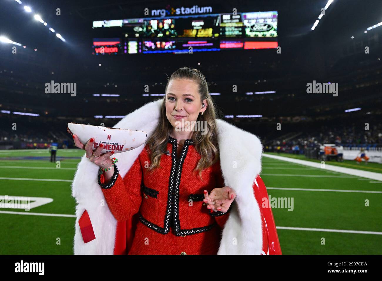 Netflix reporter Jamie Erdahl poses for a picture after taking a bite ...