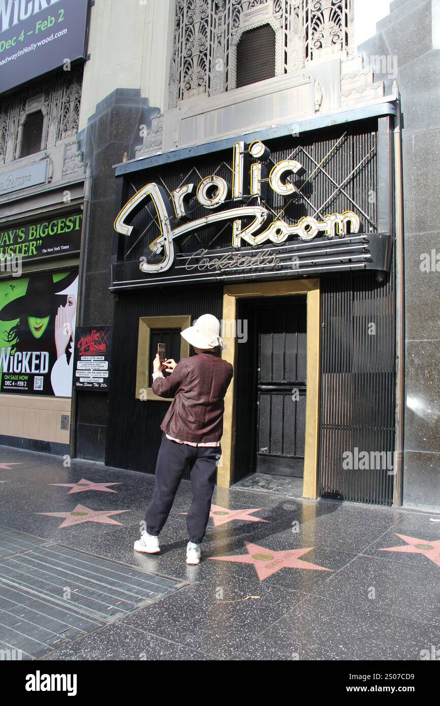 Tourist Takes Photo In Front of Frolic Room Hollywood Walk Of Fame ...