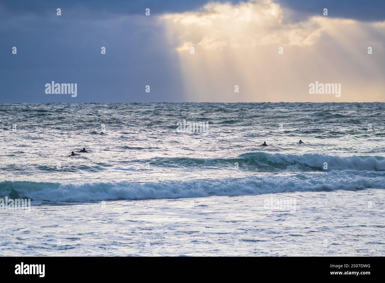 Rainy day sunrise with overcast sky and small waves at Macmasters Beach ...