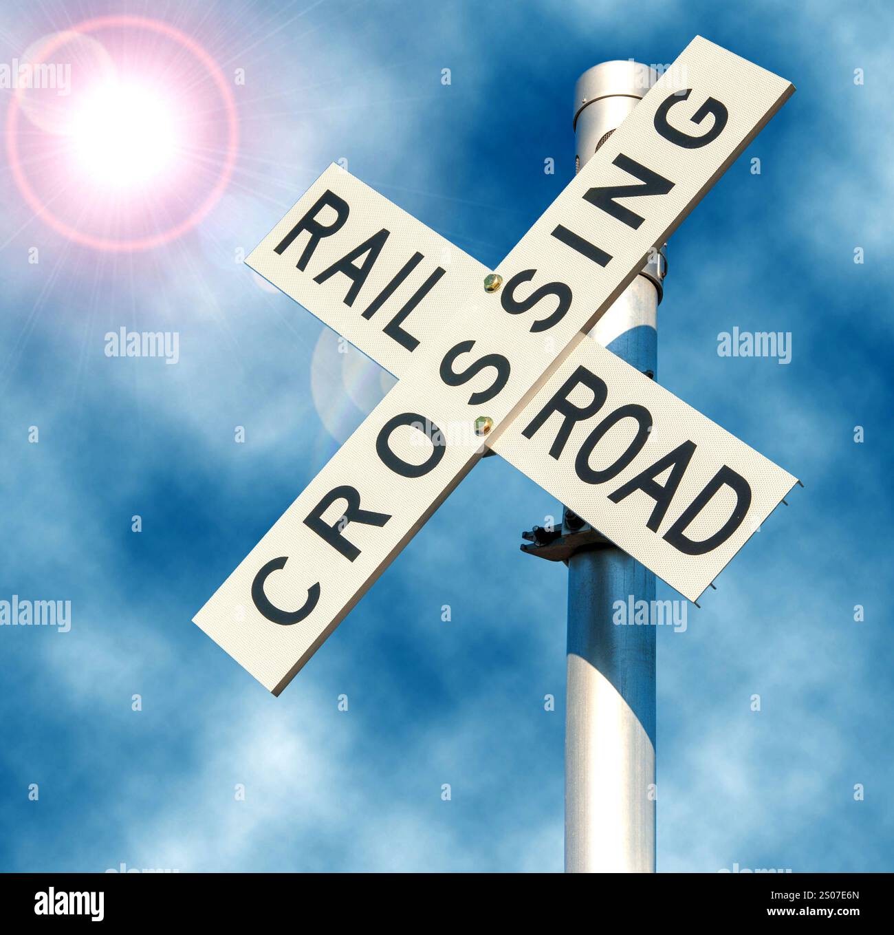 Railroad crossing sign for trains coming across roadway Stock Photo - Alamy