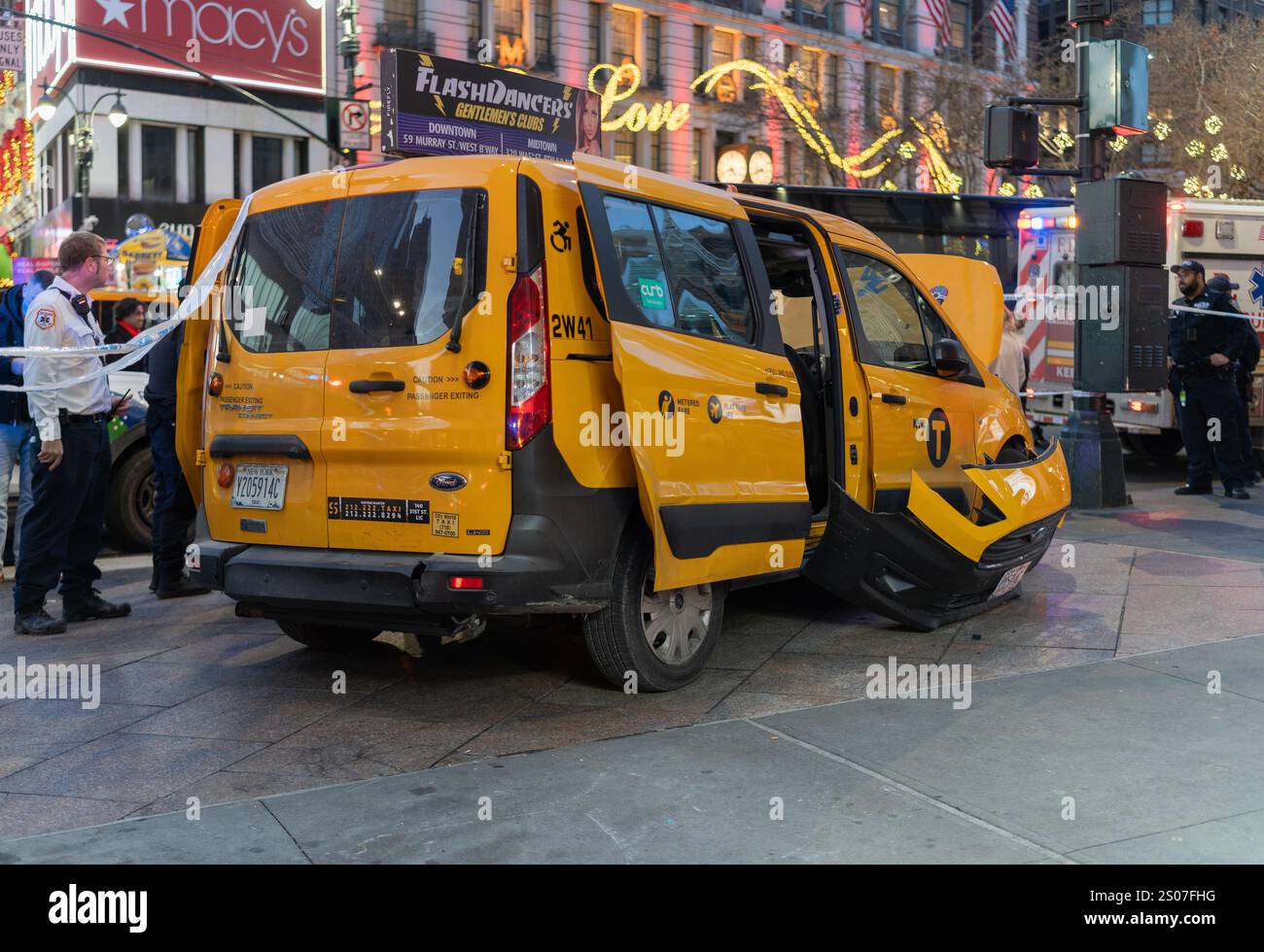New York Ciy, USA. 25th Dec, 2025. A taxi cab jumped the curb hitting ...