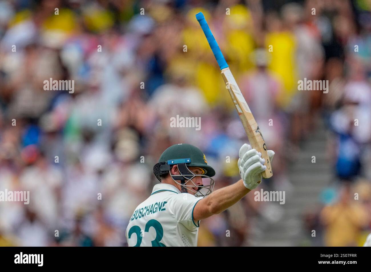 Australia's Marnus Labuschagne raises his bat as he celebrates after ...