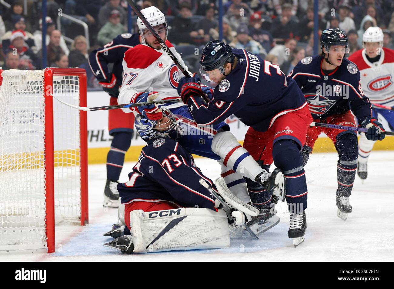 Columbus Blue Jackets defenseman Jack Johnson, right, checks Montreal ...