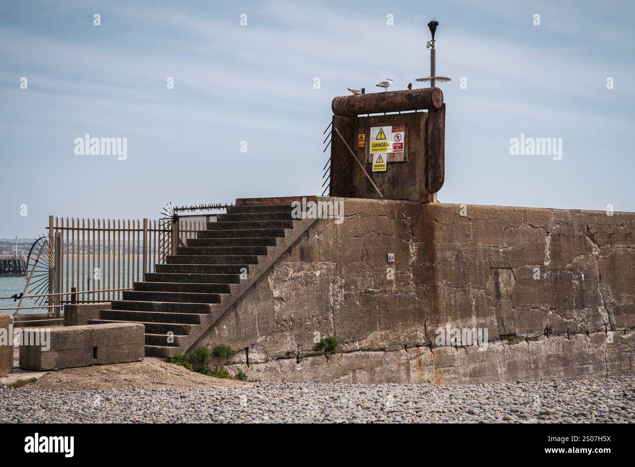 Warning signs and fences in Newhaven Harbour, East Sussex, England, UK ...