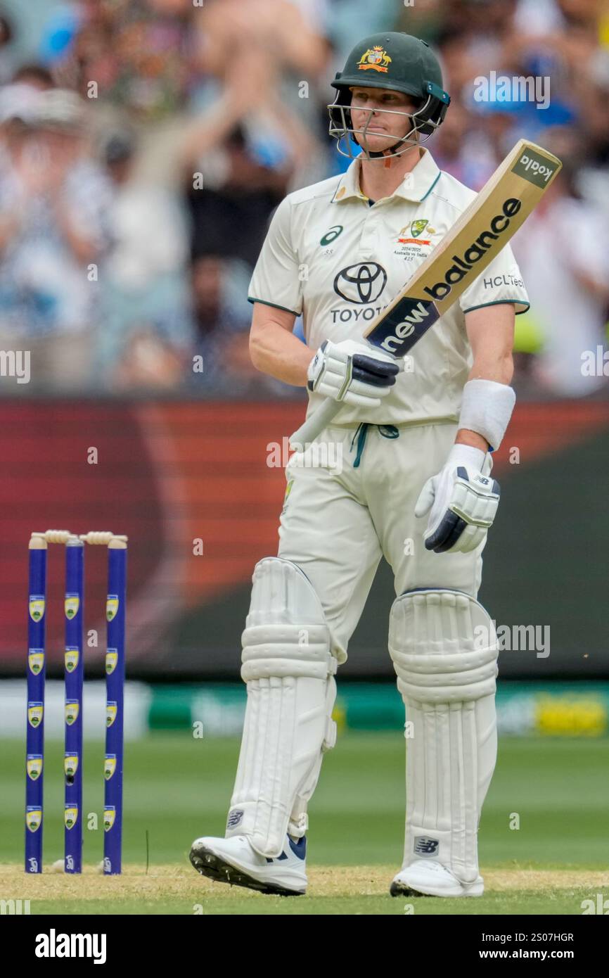 Australia's Steve Smith raises his bat as he celebrates after scoring ...