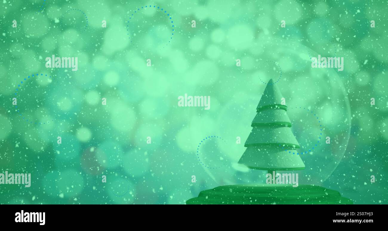 Image of christmas tree in snow globe and snow falling over green ...