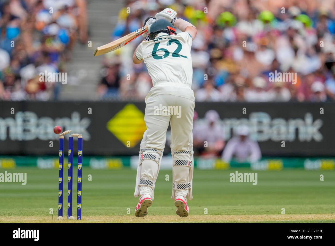 Australia's Travis Head is bowled out by India's Jasprit Bumrah during ...