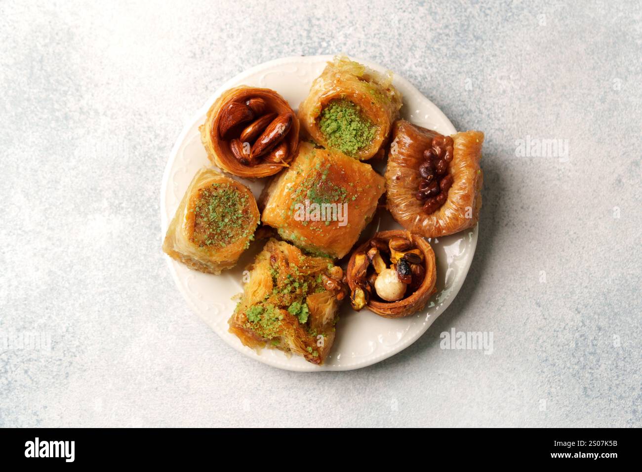 Traditional Middle Eastern desserts served on a white plate showcasing ...